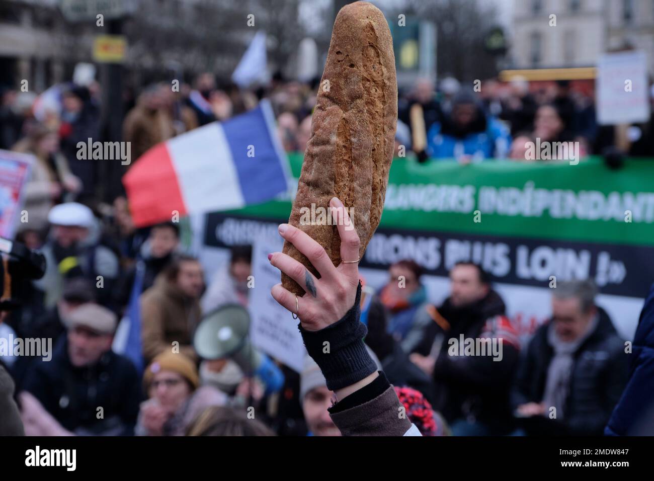 Paris, Ile de France, FRANCE. 23rd Jan, 2023. A woman holds a bread in ...