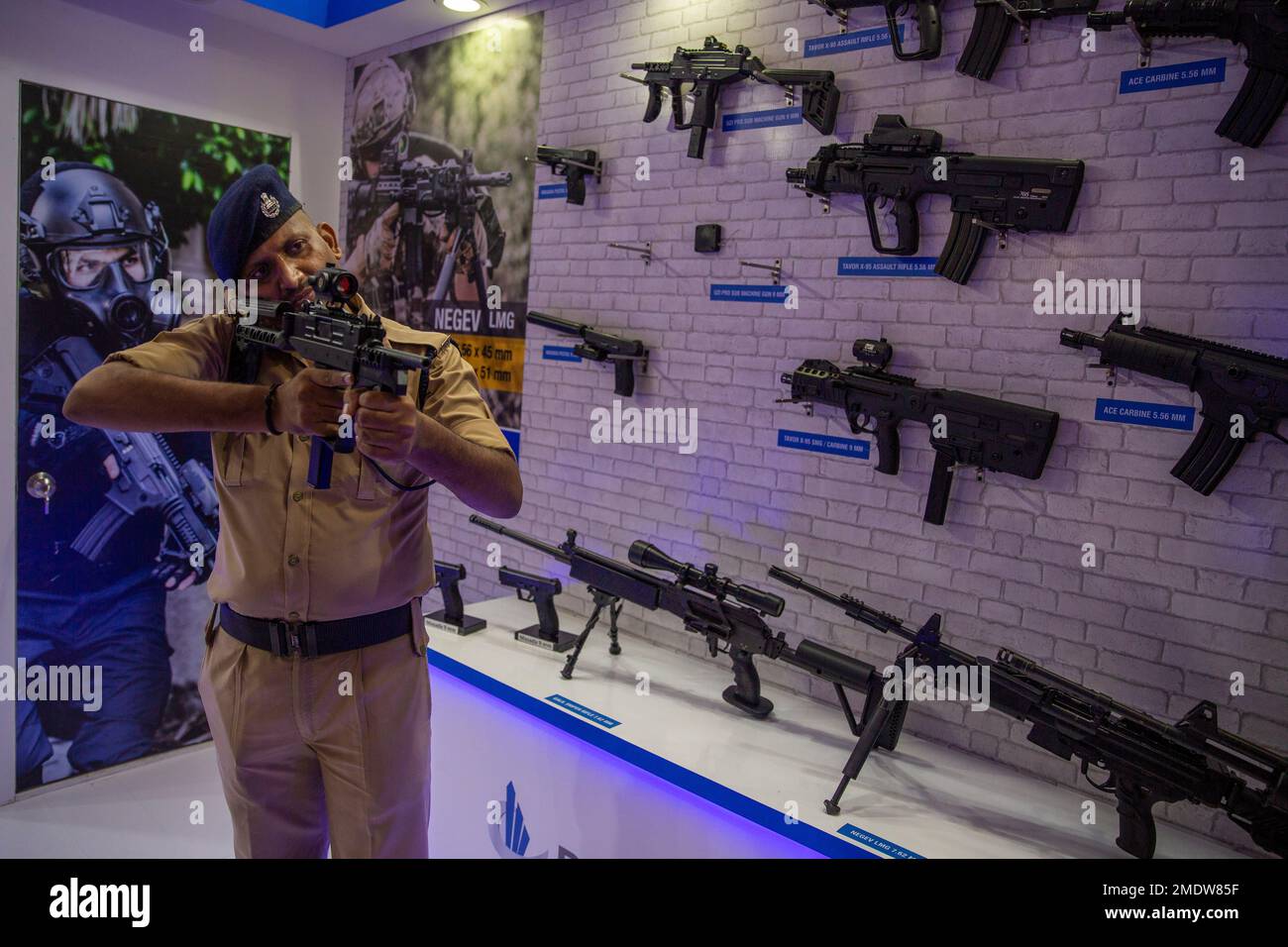 An Indian paramilitary soldier checks the working of an UZI Pro Sub ...