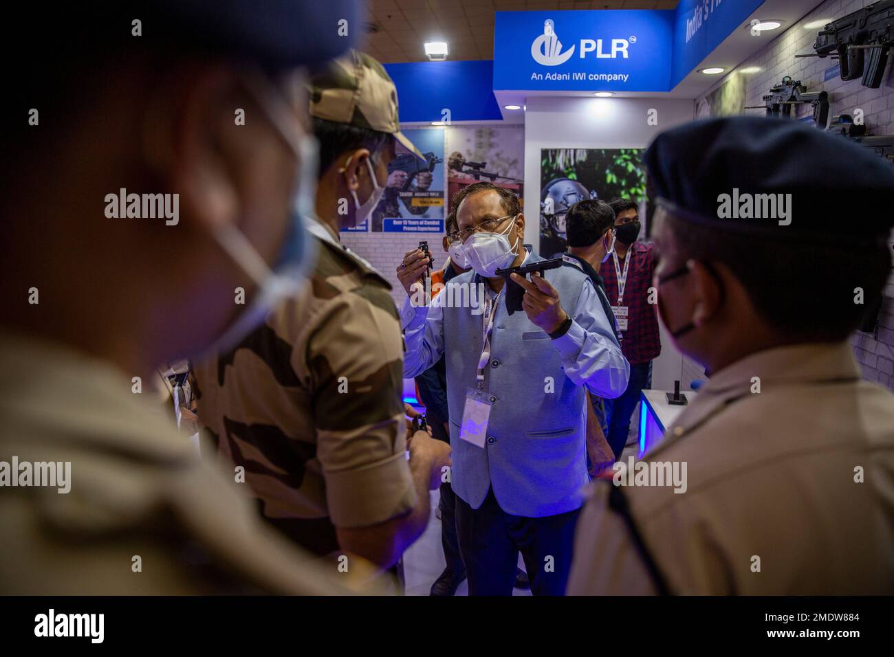 An exhibitor shows the working of Masada Pistol manufactured by PLR ...