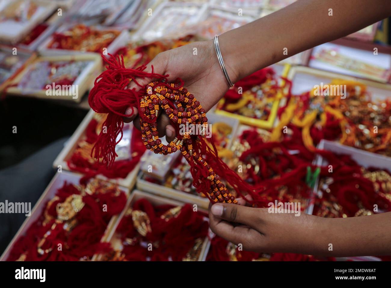 An Indian girl shop for "Rakhi," a sacred thread, on Raksha Bandhan ...