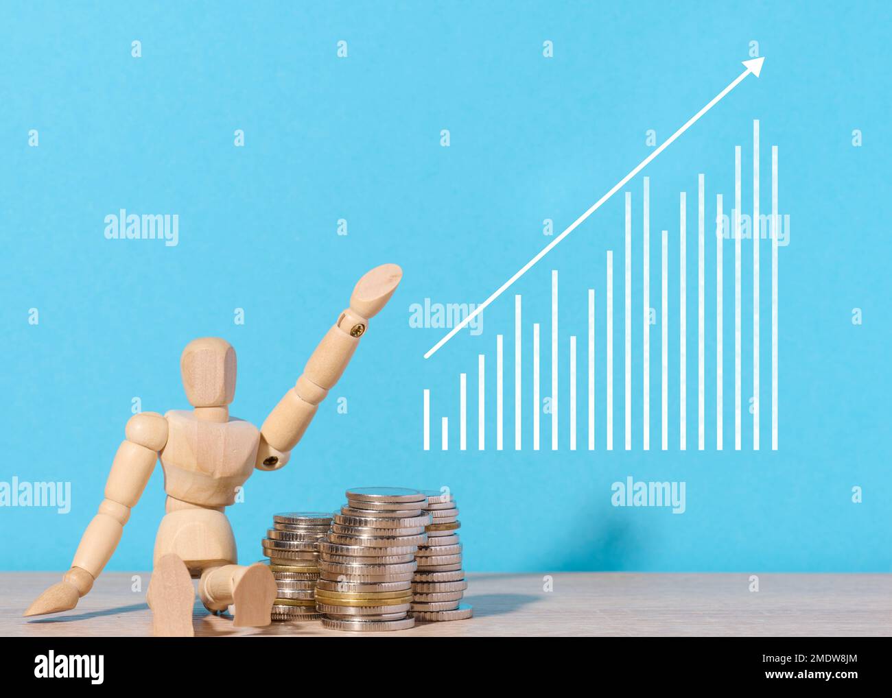 Wooden mannequin and graph with growing indicators, high income. Blue ...