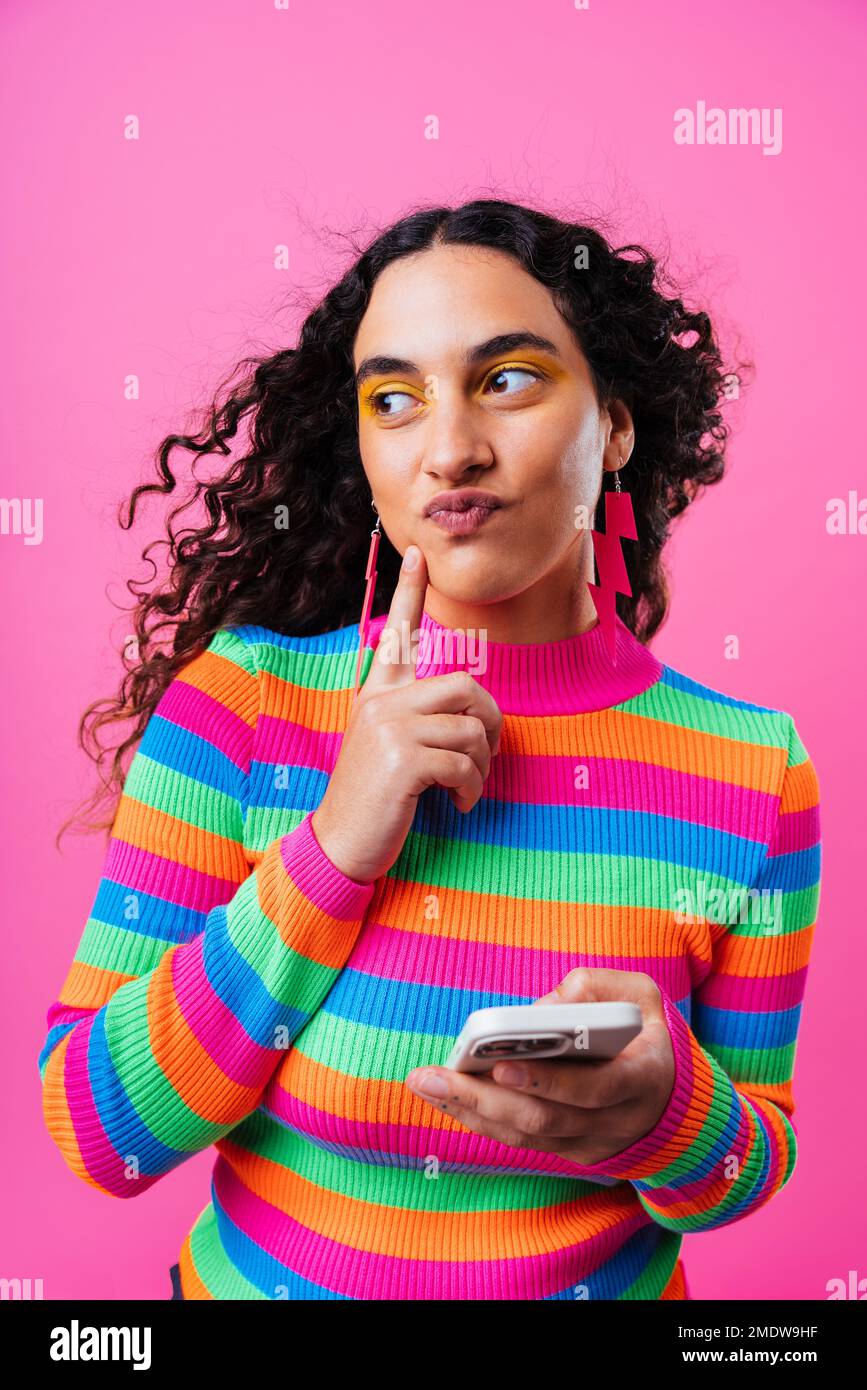 Beautiful young hispanic woman with diastema with colorful and cool ...