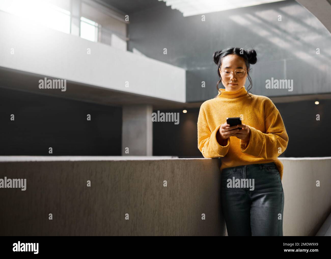 Woman, phone and texting in office building, relax and calm while on ...