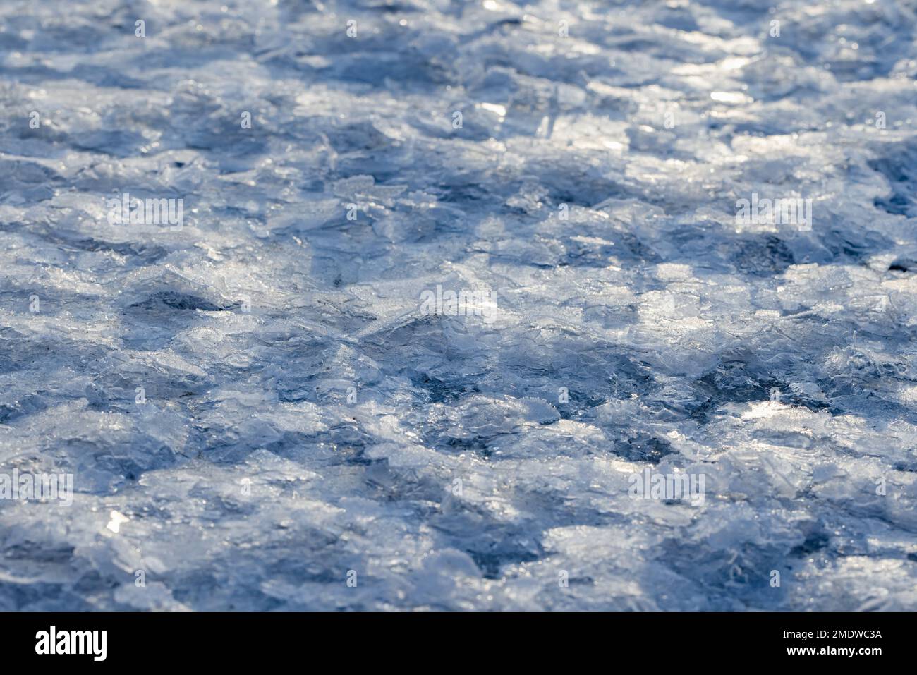 Frozen river surface with fragments of broken thin ice, natural ...