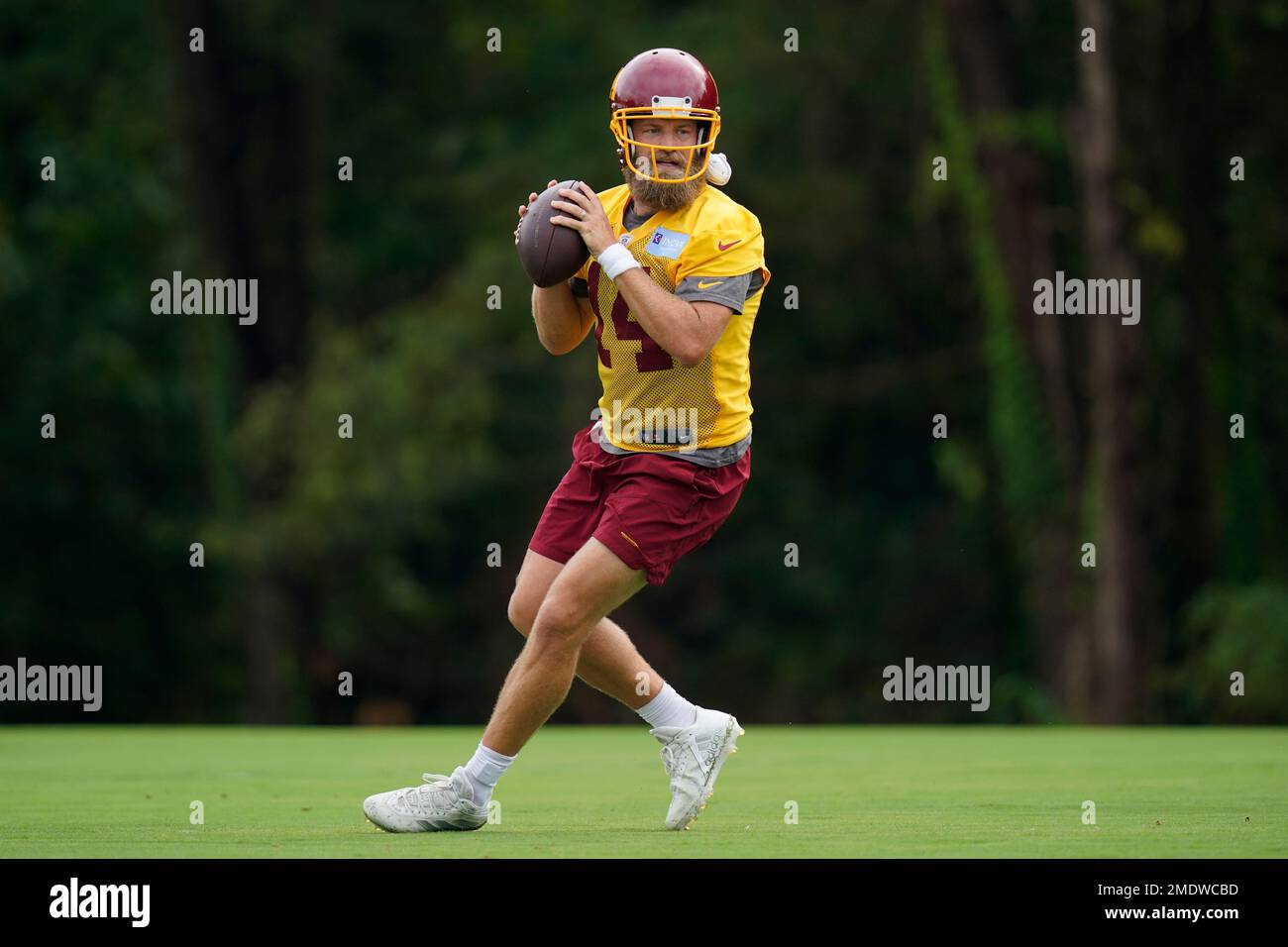 Washington Football Team quarterback Ryan Fitzpatrick runs a drill ...