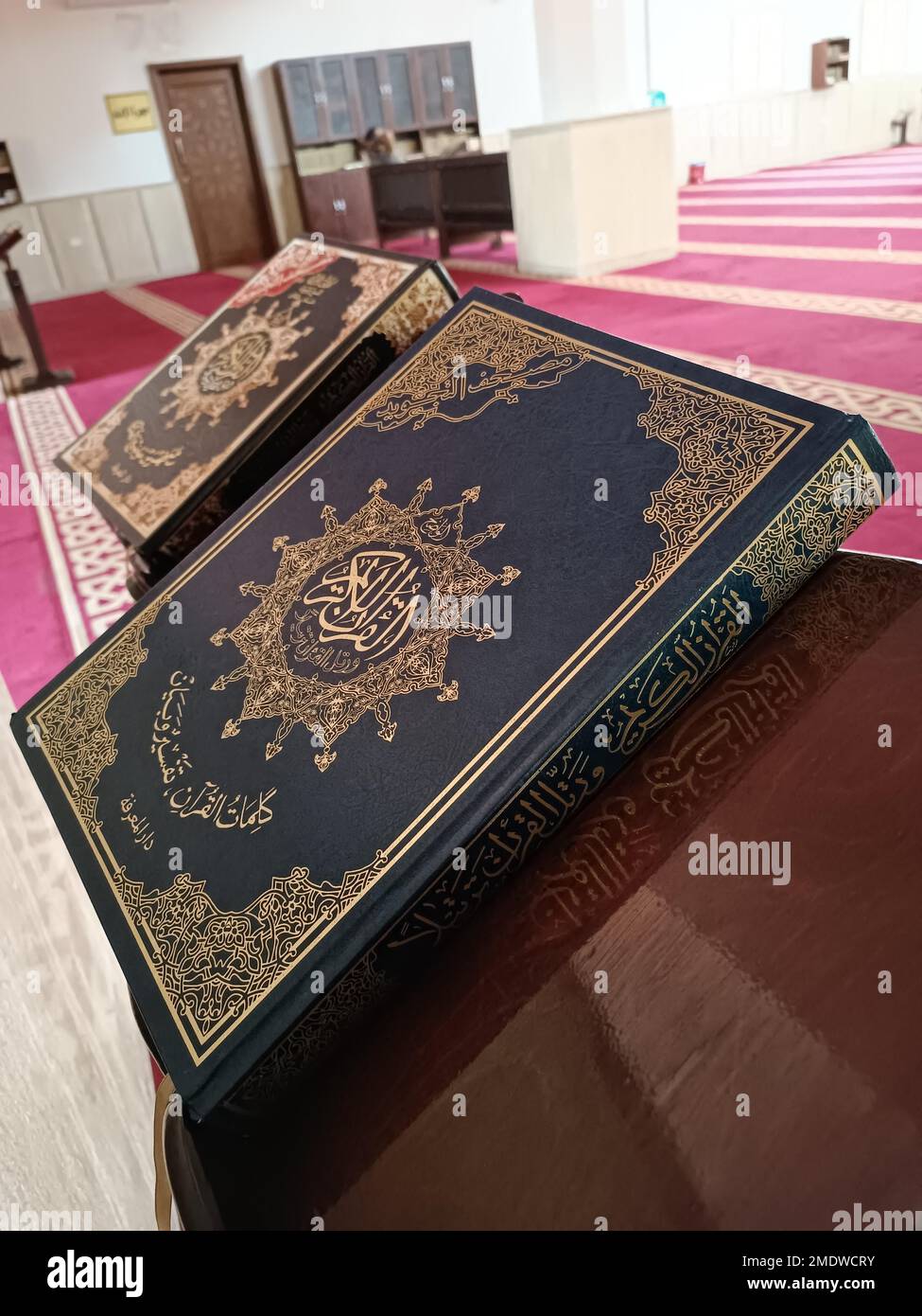 A vertical closeup of Quran in a mosque Stock Photo - Alamy