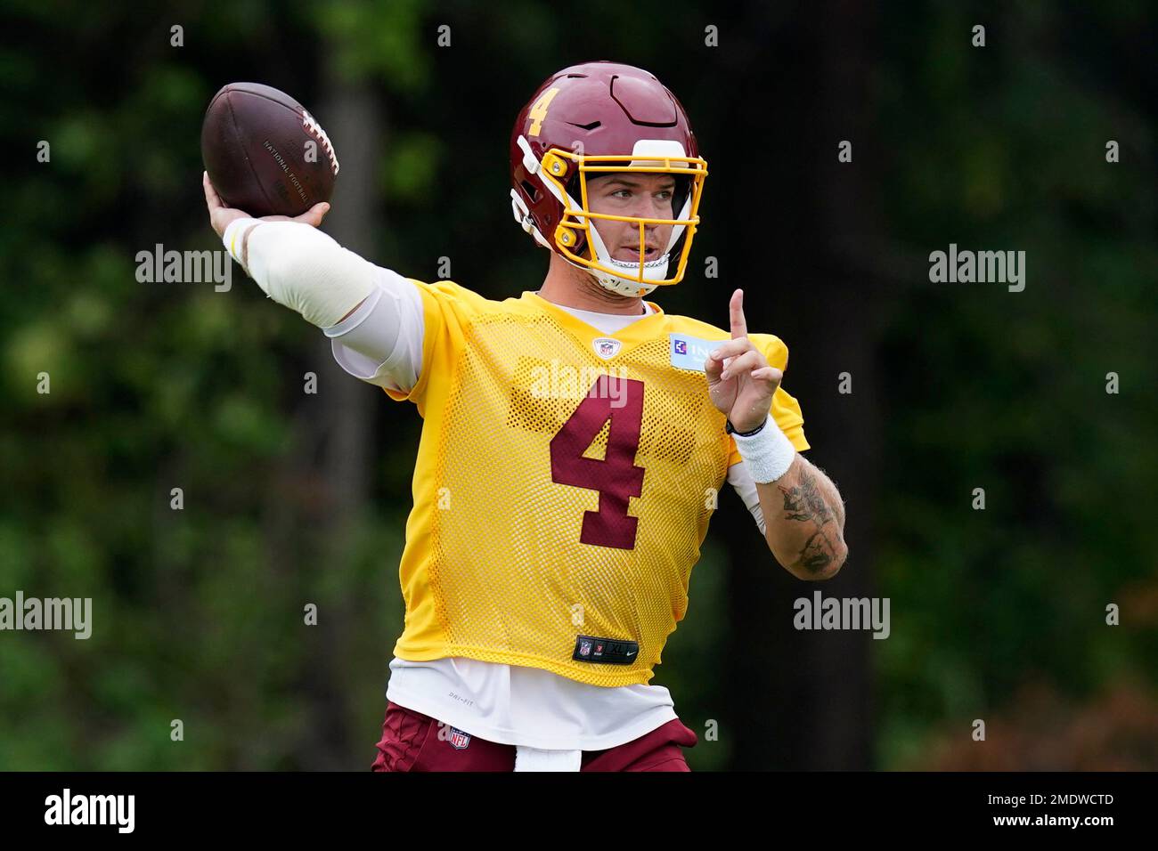 Washington Football Team quarterback Taylor Heinicke runs a drill ...