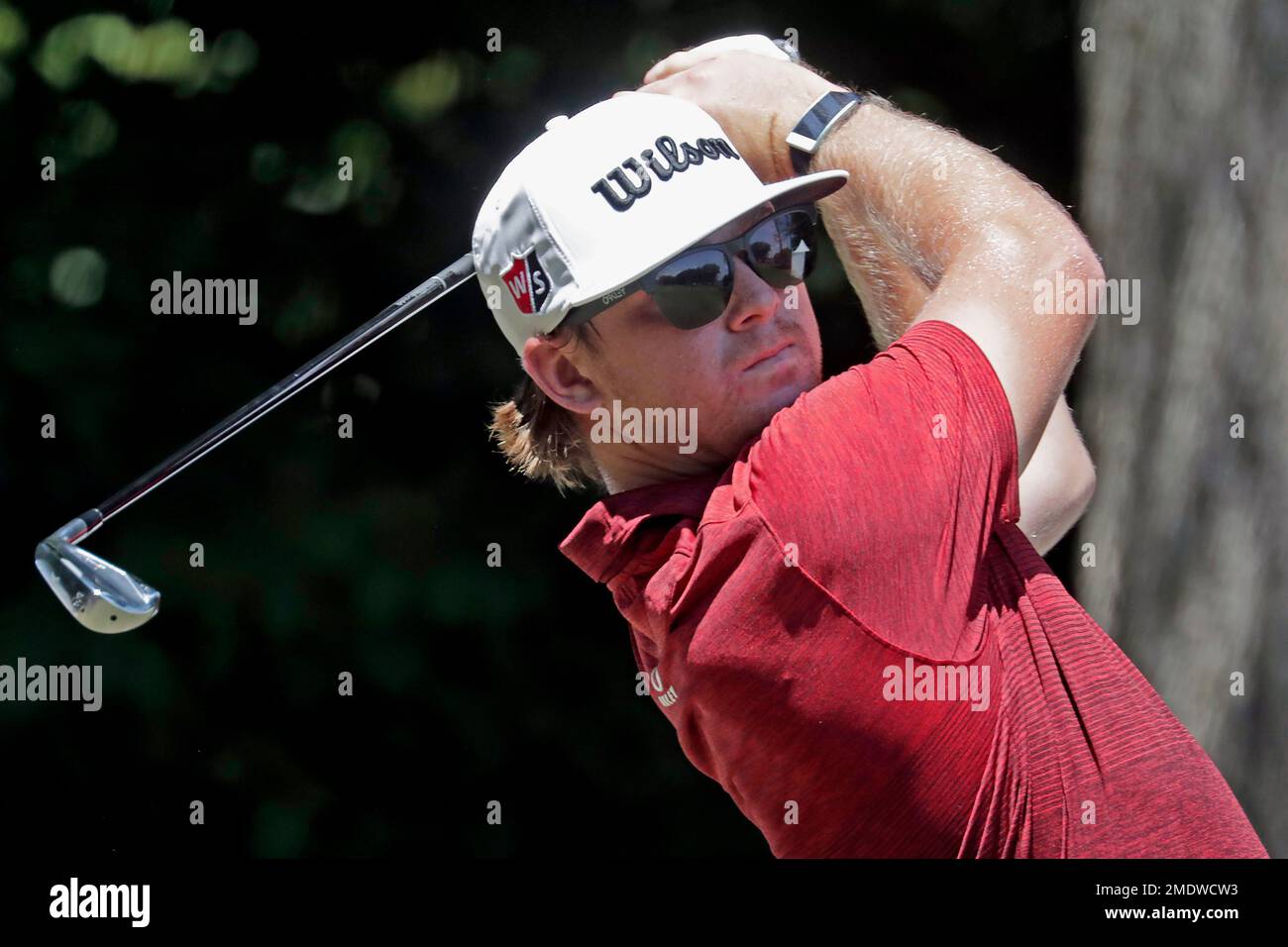 John Augenstein watches his tee shot on the second hole during the ...