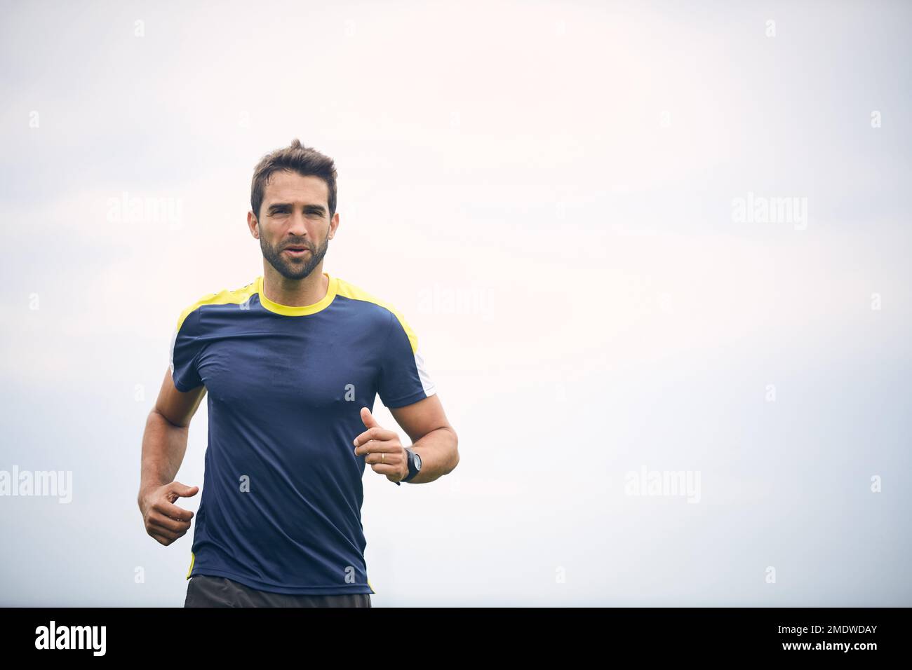The more you run the easier it gets. a middle aged man out running ...