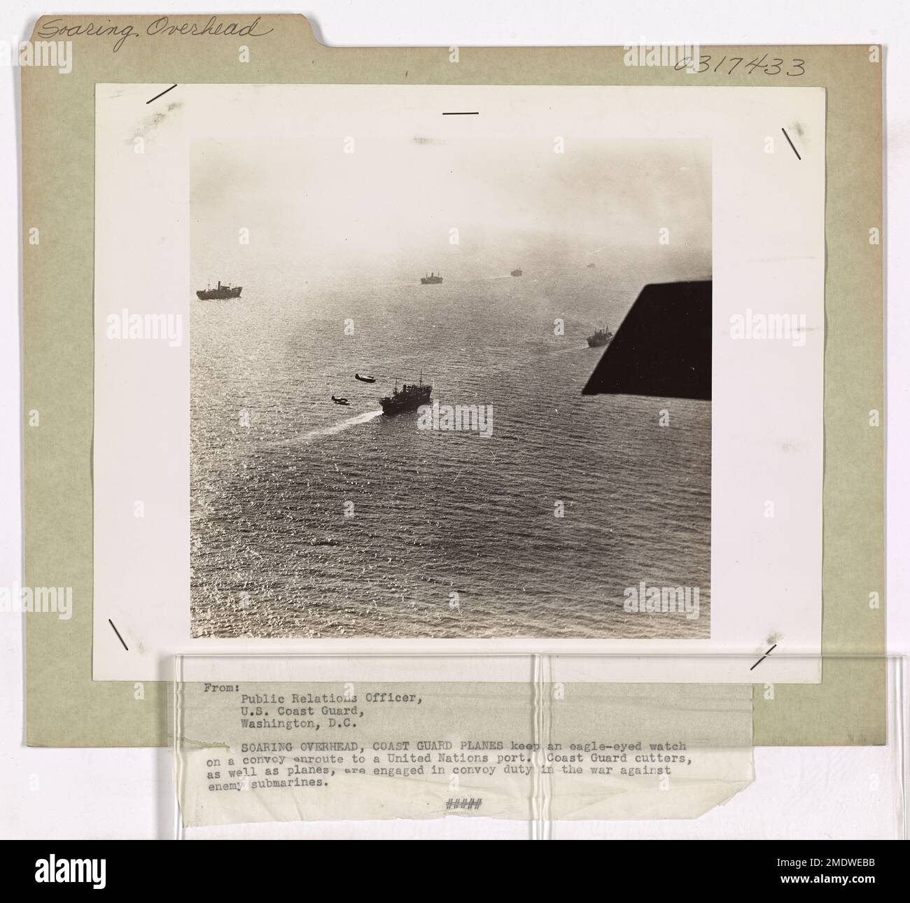 Coast Guard planes monitor a convoy en route to a United Nations port ...