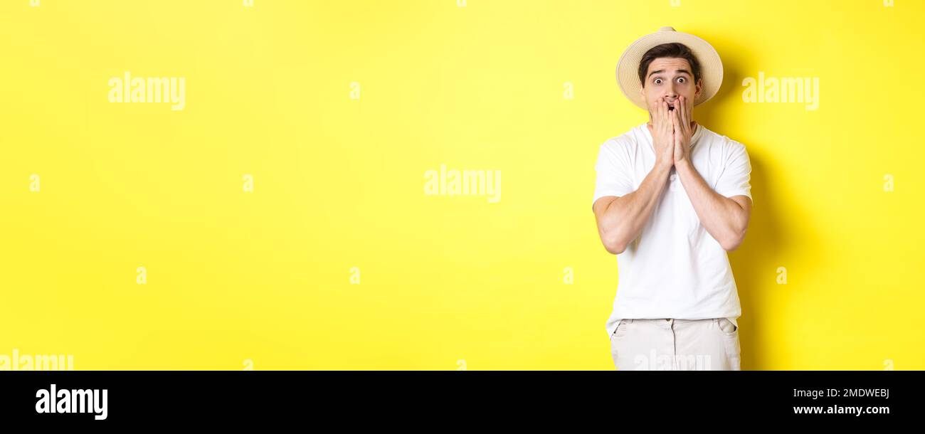 Concept of tourism and summer. Shocked guy jumping from fear, standing ...