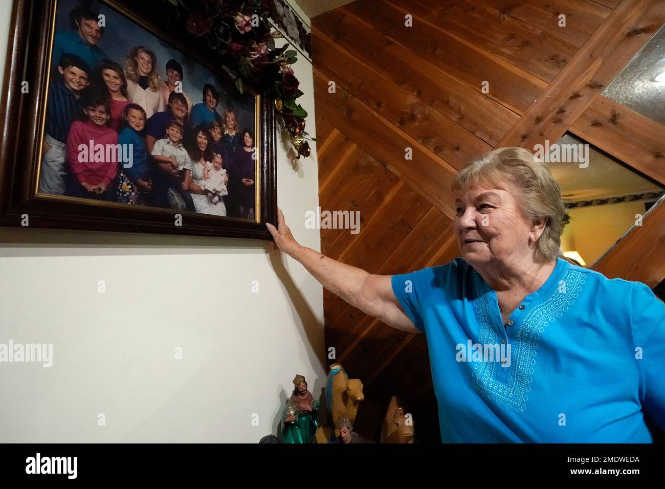 Frances Sims, looks over a family photo at her home Tuesday, Aug. 10 ...