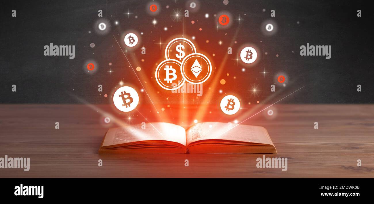 Open book with currency icons above Stock Photo - Alamy