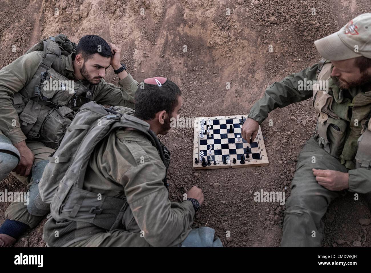 Israeli soldiers play chess at their position near the Israel-Gaza ...