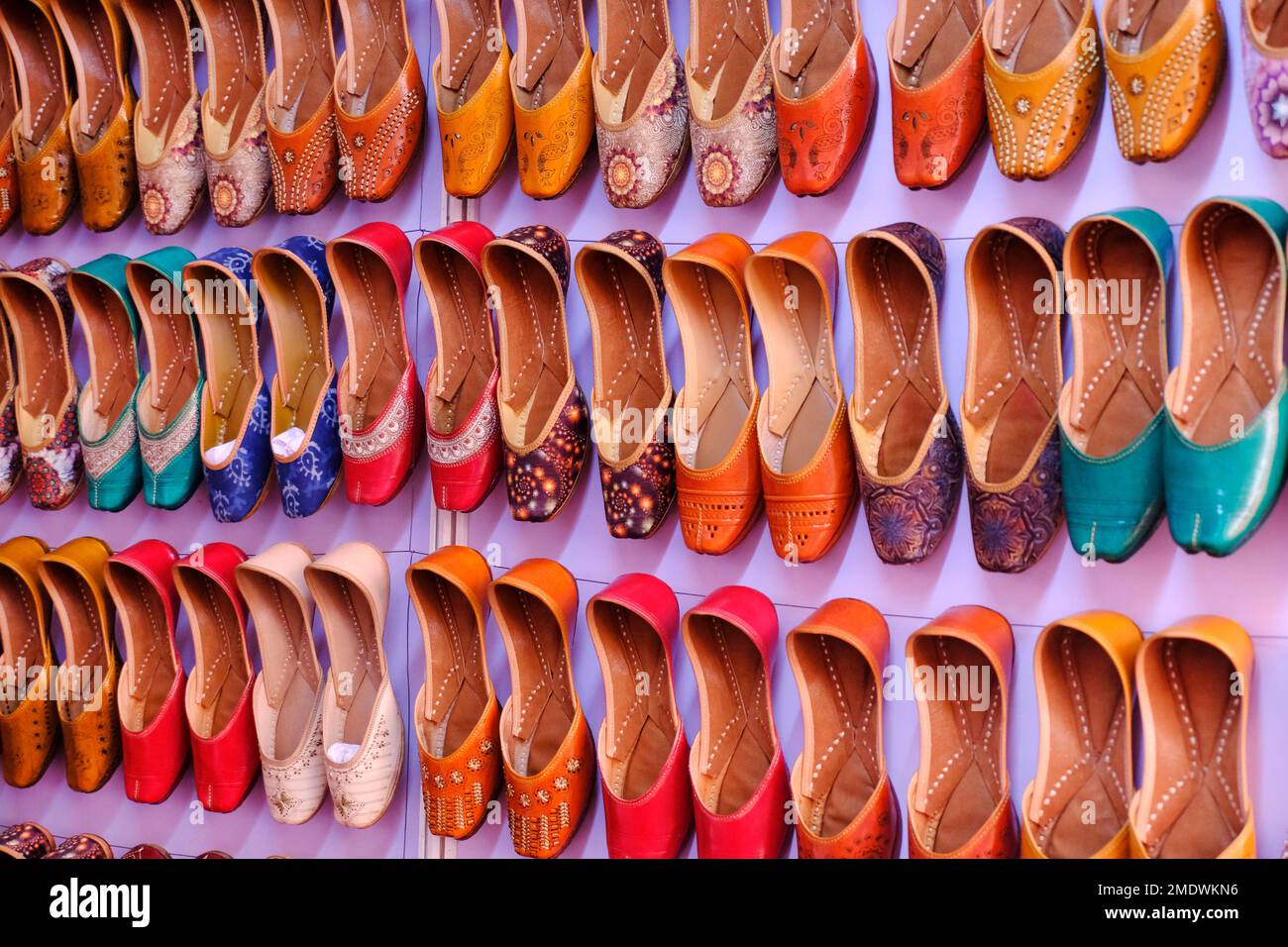 Colorful Handmade chappals (sandals) being sold in an Indian market ...