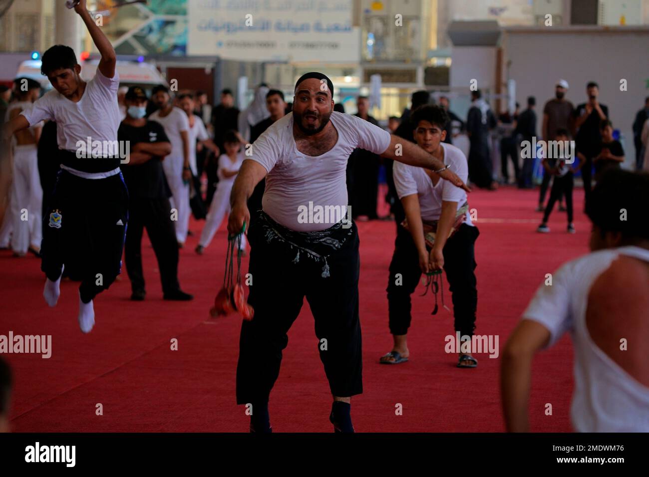 Shiite faithful pilgrims beat themselves chains as a sign of grief for ...