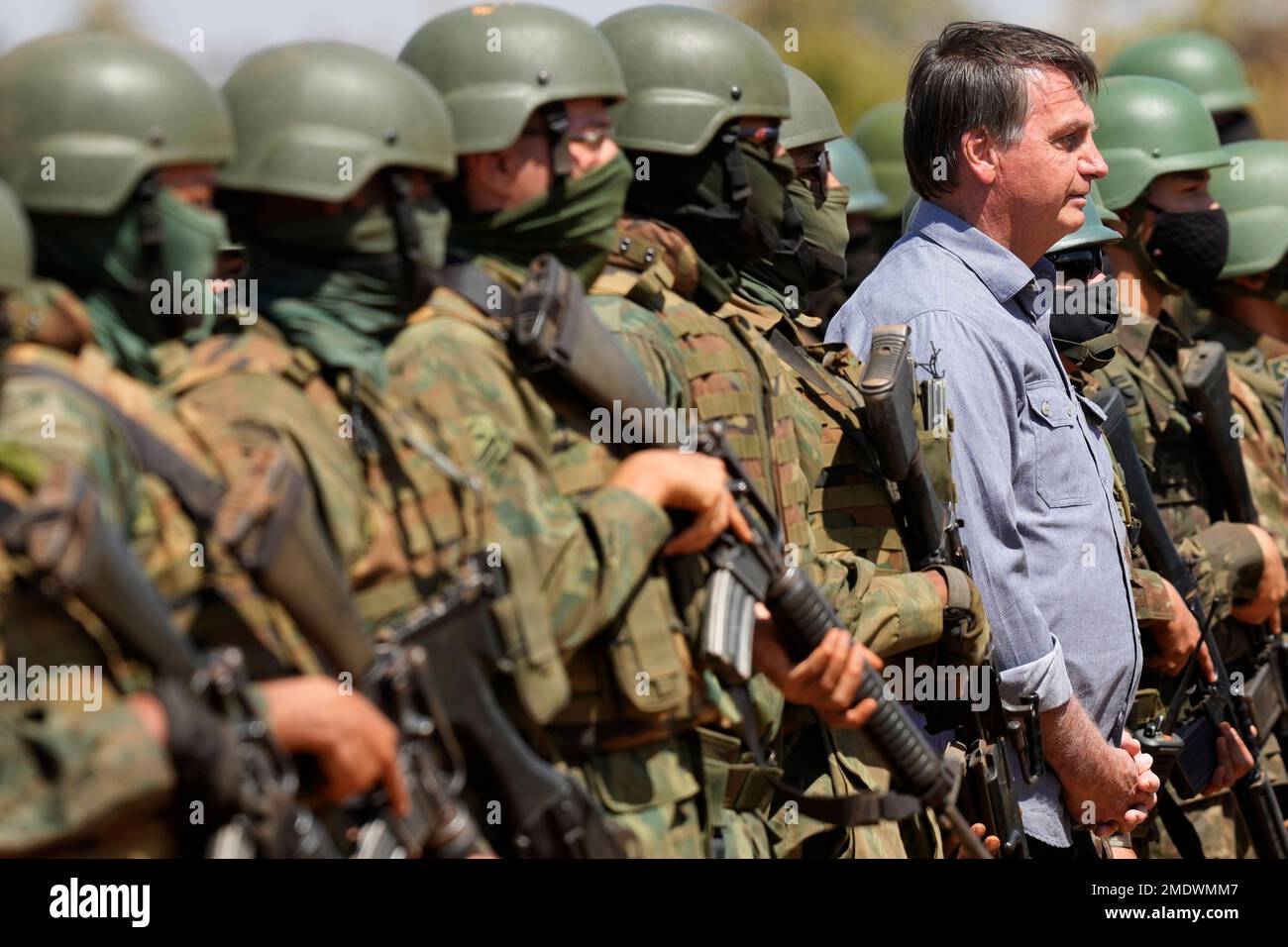 Brazilian President Jair Bolsonaro poses for photos with the soldiers ...