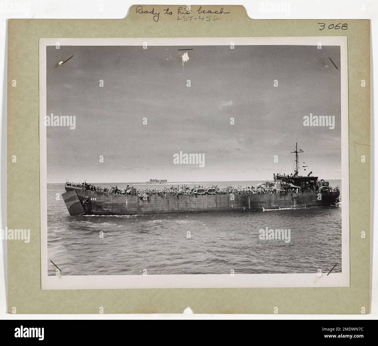 An LST (Landing Ship, Tanks) heads toward the shore for the invasion of ...