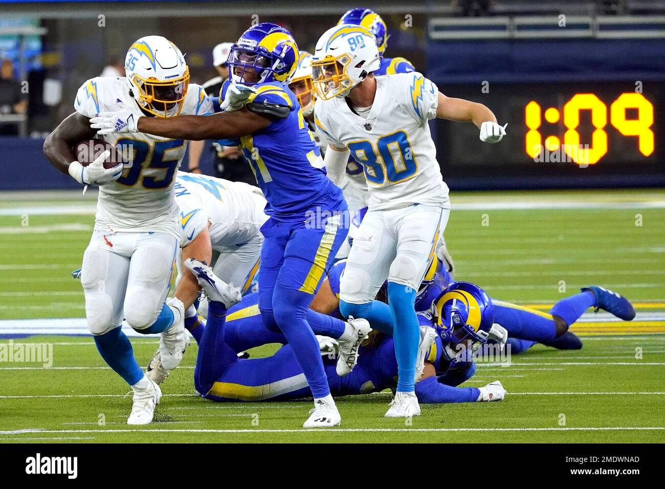 Los Angeles Rams cornerback Robert Rochell, second from left, reaches ...