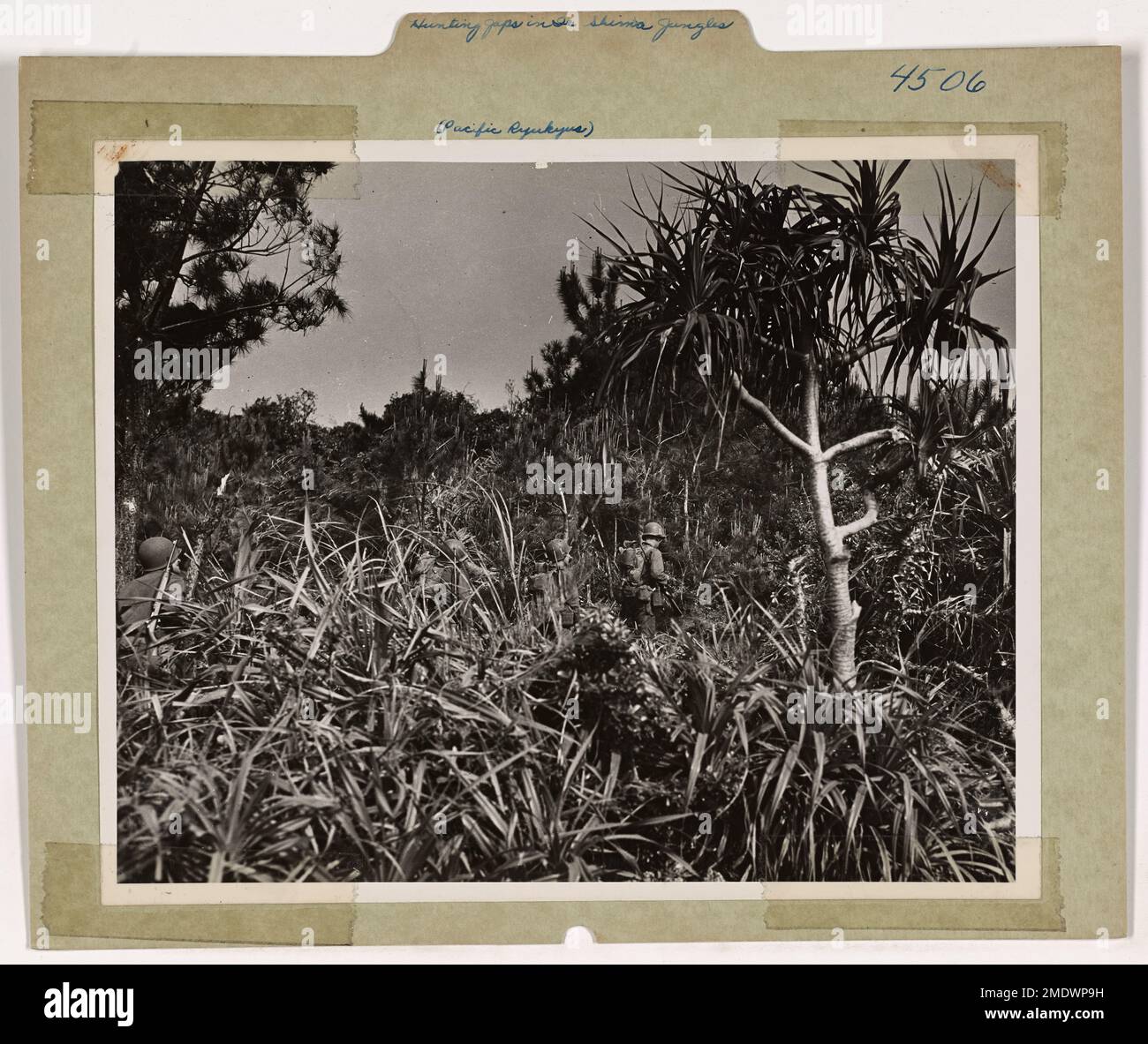 This image captures American 10th Army troops as they cautiously move ...