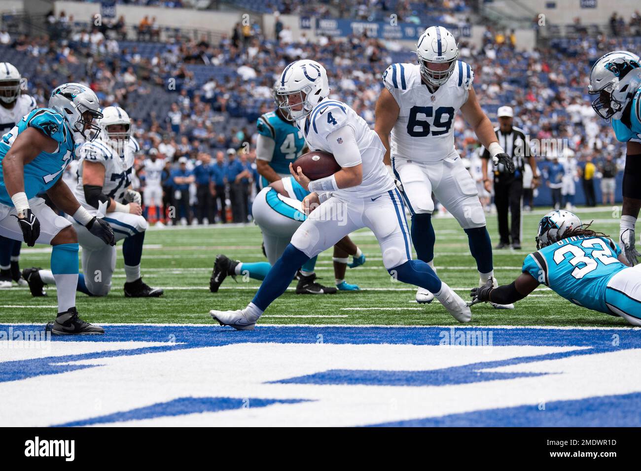Indianapolis Colts quarterback Sam Ehlinger (4) runs up the middle for ...