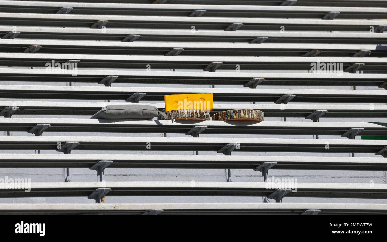 A cheesehead sits on seats before the Green Bay Packers' preseason NFL ...