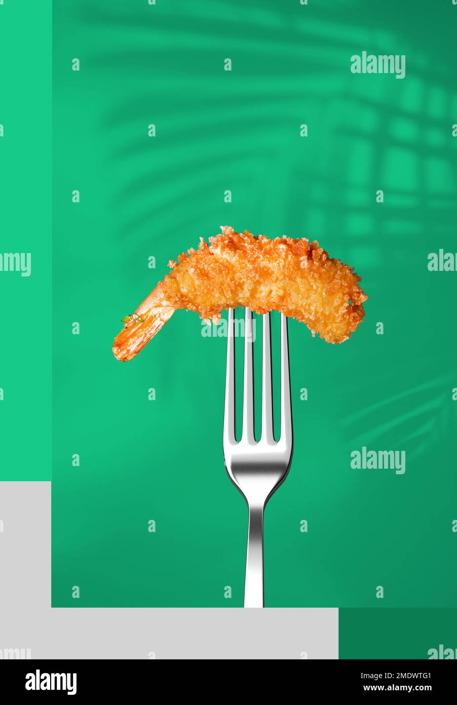 Fried shrimp in panko on a fork isolated on a green background. Poster ...