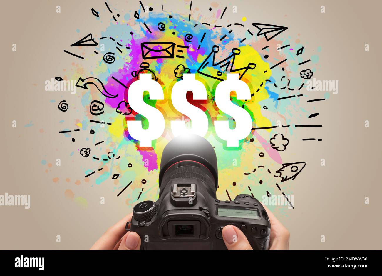 Close-up of a hand holding digital camera with abstract drawing concept ...