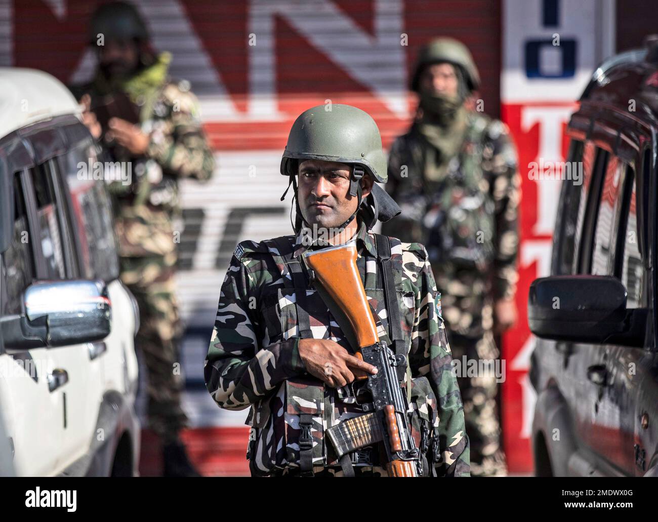 Indian paramilitary soldiers stand guard during a flag hosting ceremony ...