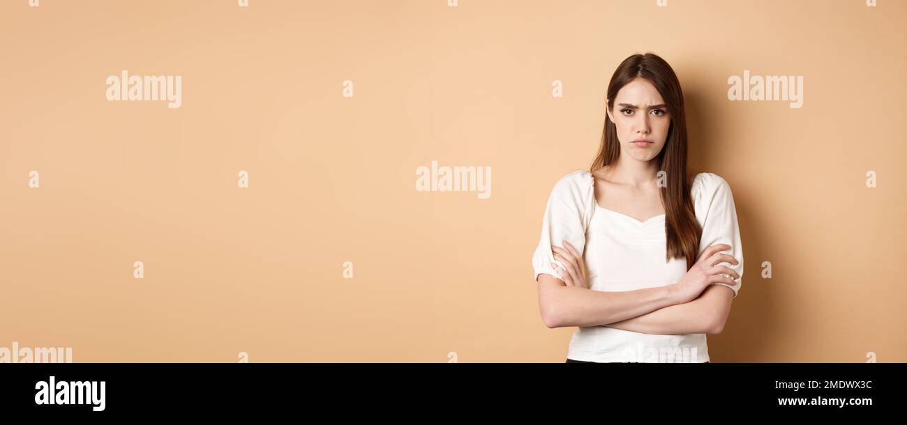 Angry girlfriend cross arms on chest and frowning, looking offended or ...