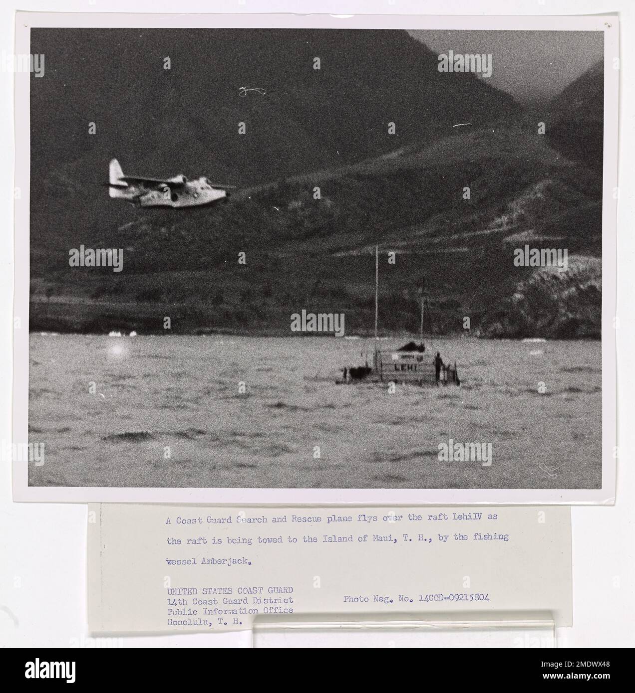 A Coast Guard aircraft assists the fishing vessel AMBERJACK as it tows ...