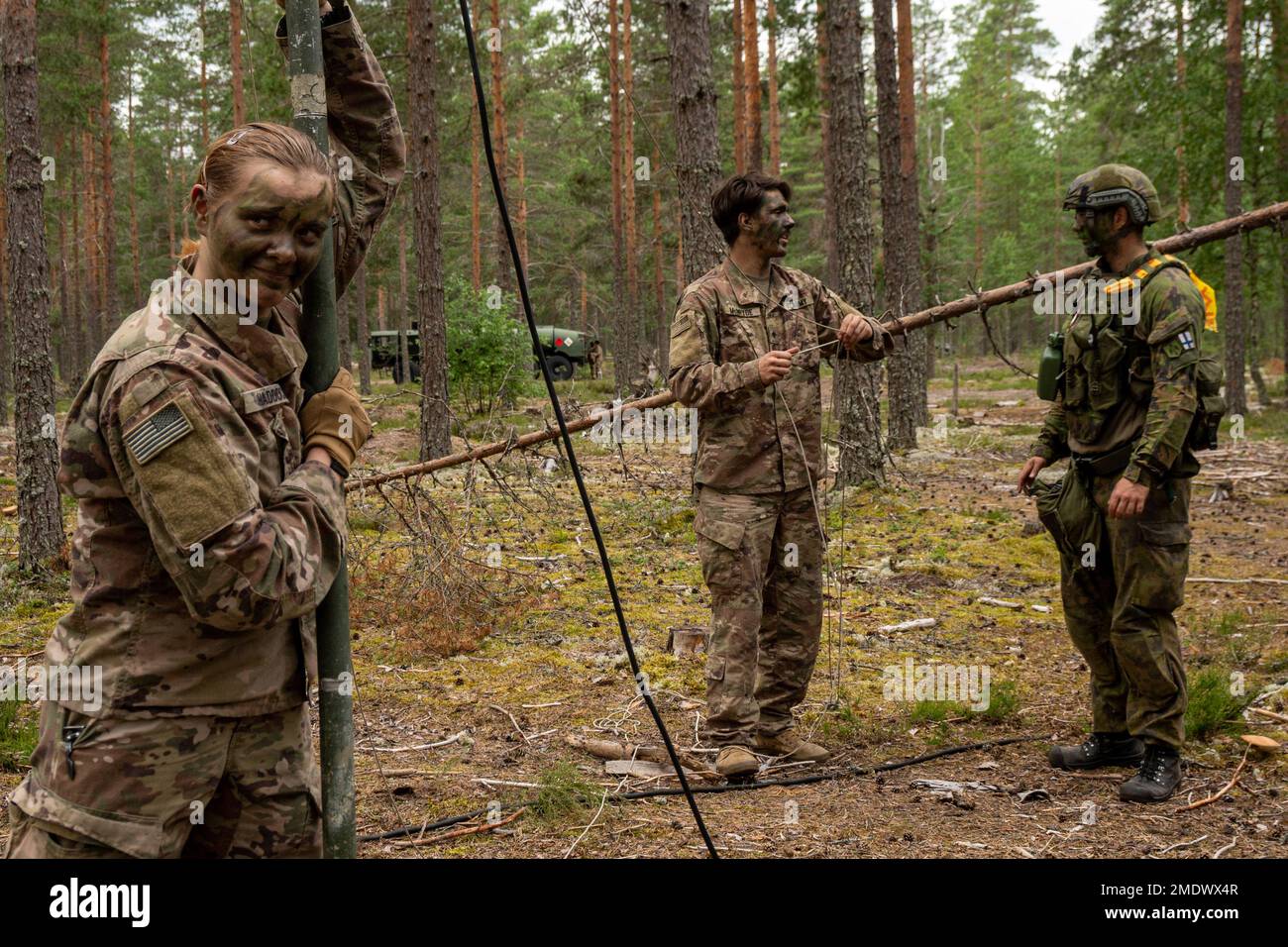 U.S. Army Pfc. Janna Haddock, left, an advanced field artillery ...