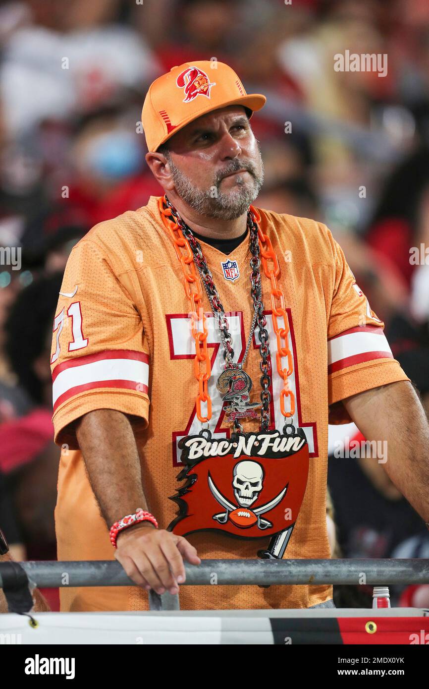 A Tampa Bay Buccaneer fan watches after a penalty is called against the ...