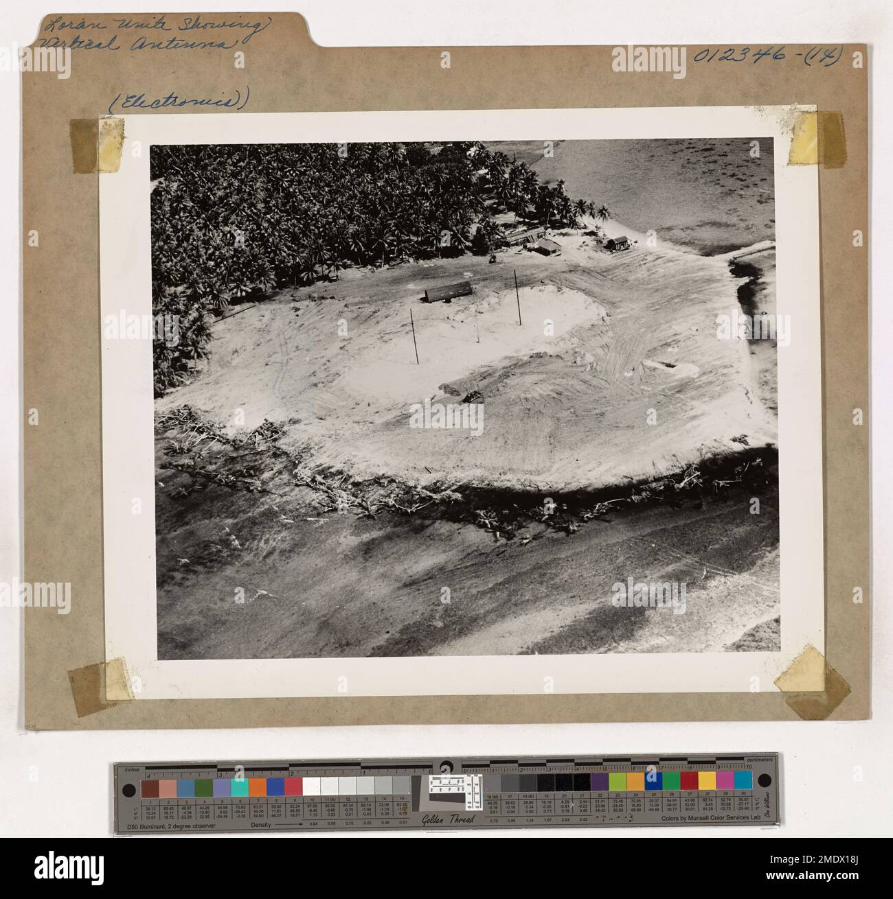 An aerial view of a Loran unit, featuring a vertical antenna and its ...