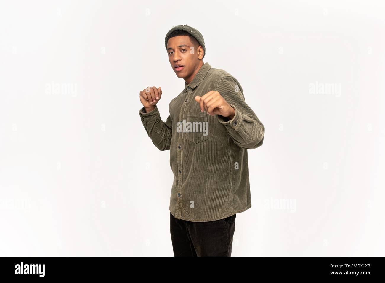 Young dark skinned guy man singing, dancing and relaxing isolated on ...