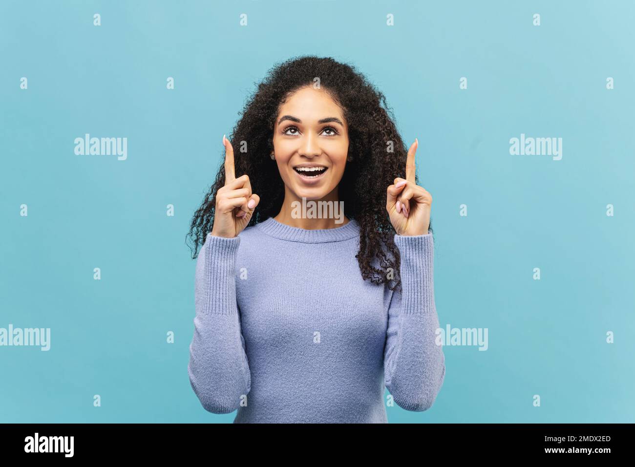 Woman points index fingers up hi-res stock photography and images - Alamy
