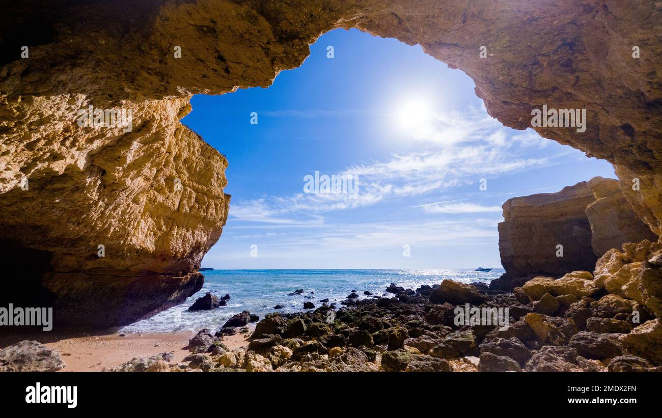 A scenic view of a beautiful seascape seen from a cave located on the ...