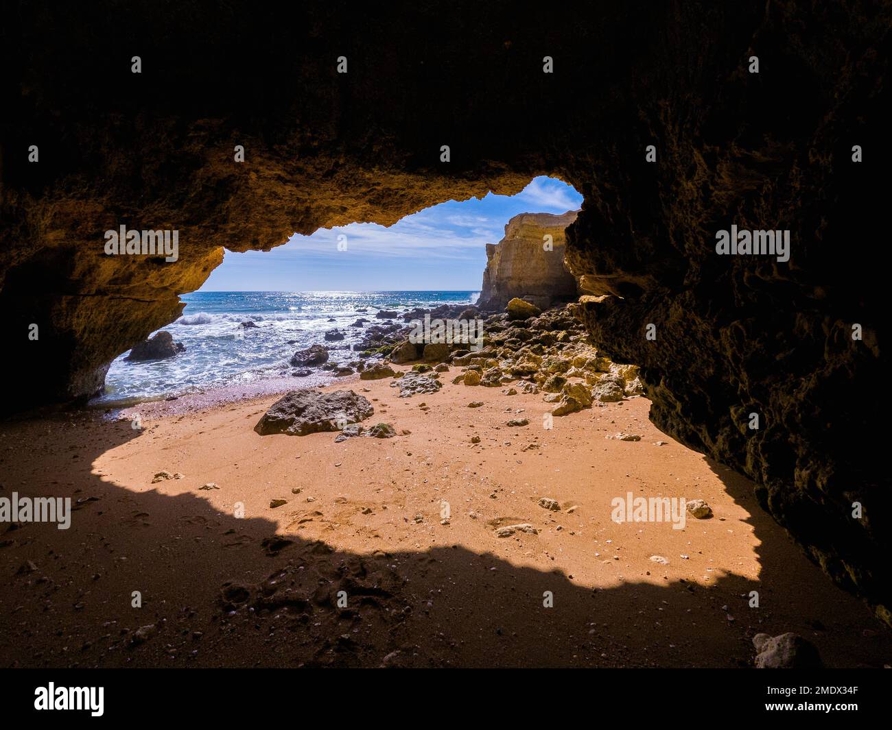 A scenic view of a beautiful seascape seen from a cave located on the ...