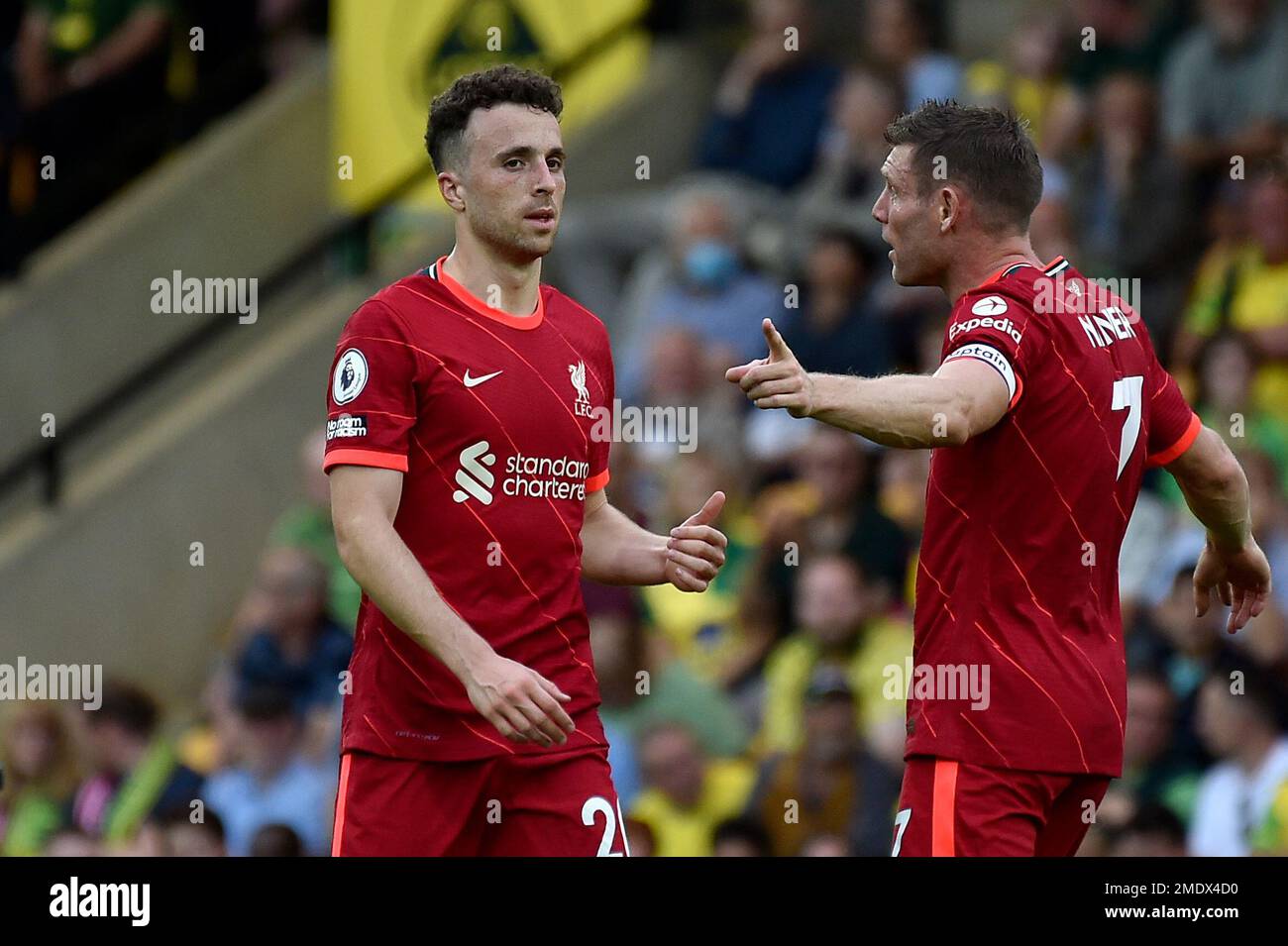 Liverpool's team captain James Milner, right, talks to teammate Diogo ...