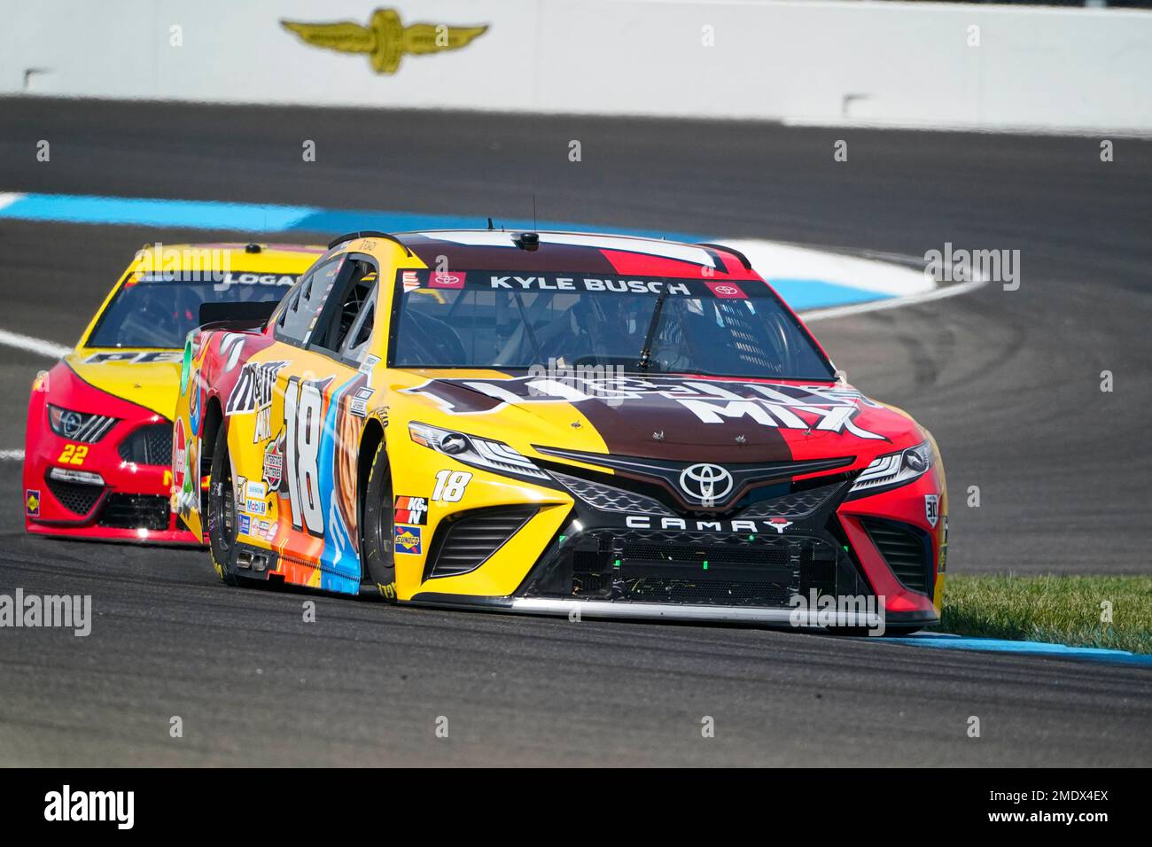 Kyle Busch (18) drives through a turn during practice for the NASCAR ...