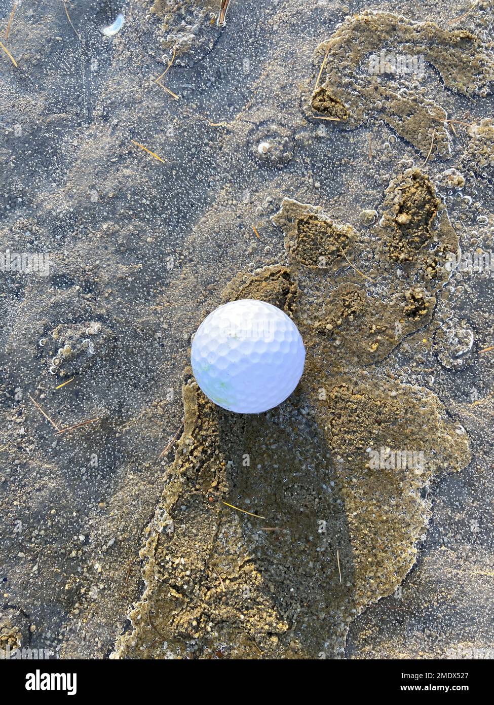 Golf Ball in Sand Trap with Ice and Sunlight in Lugano, Ticino in ...