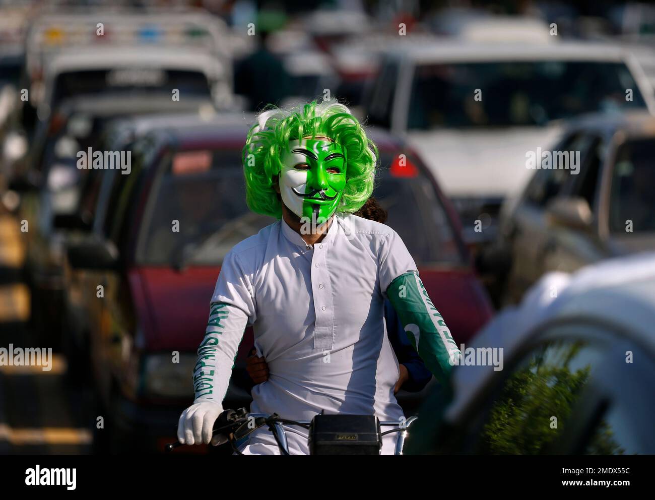 A boy wears a mask with the colors of the national flag to celebrate ...