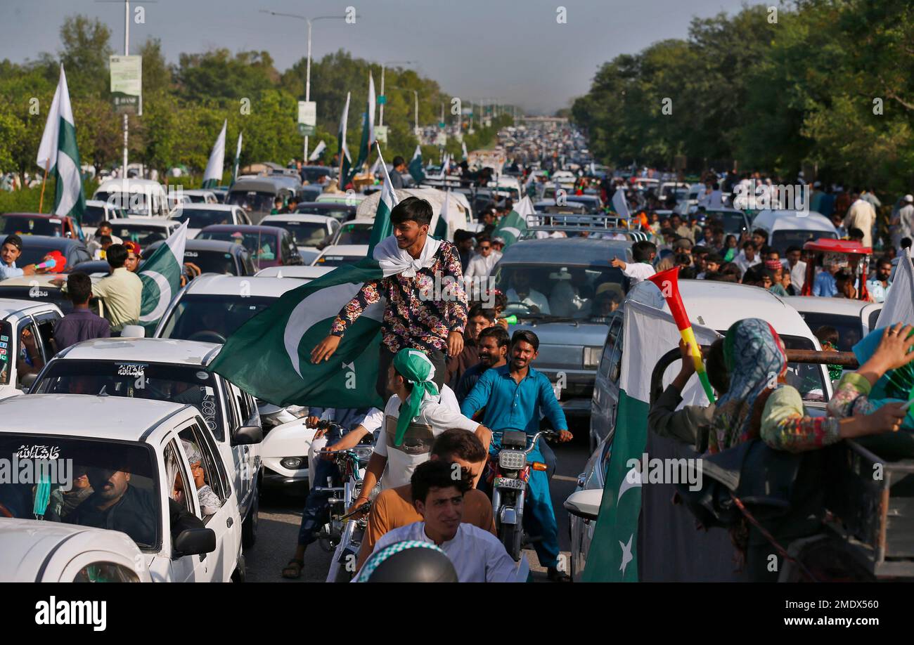People with national flags march on a road to celebrate Independence ...