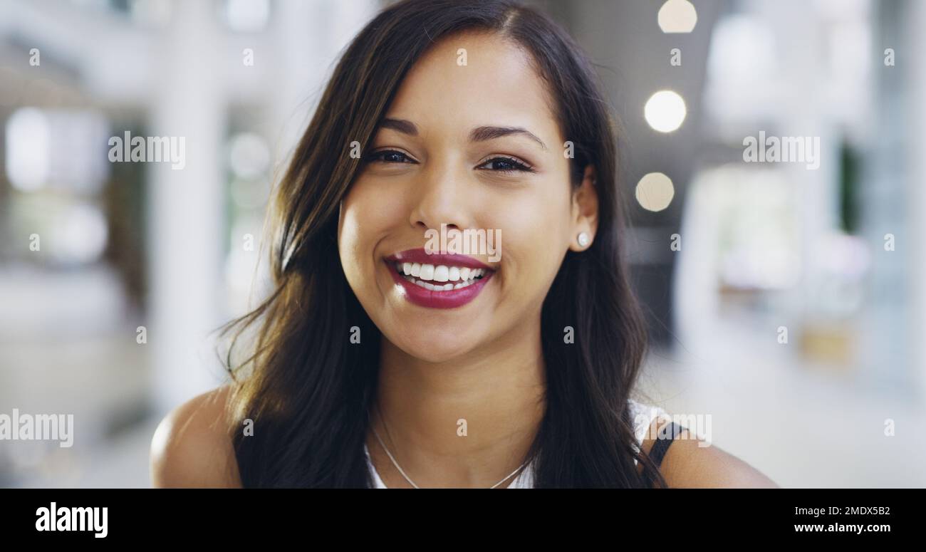 Having a positive outlook is key to being successful. a confident young ...