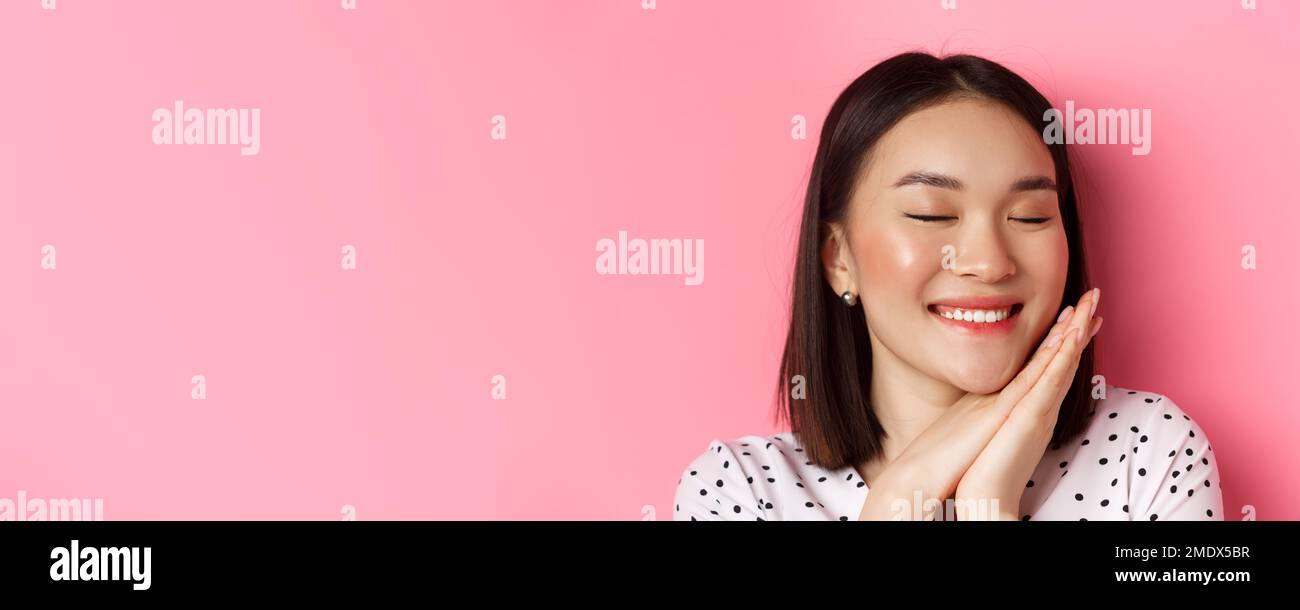 Beauty and skin care concept. Headshot of adorable and dreamy asian ...