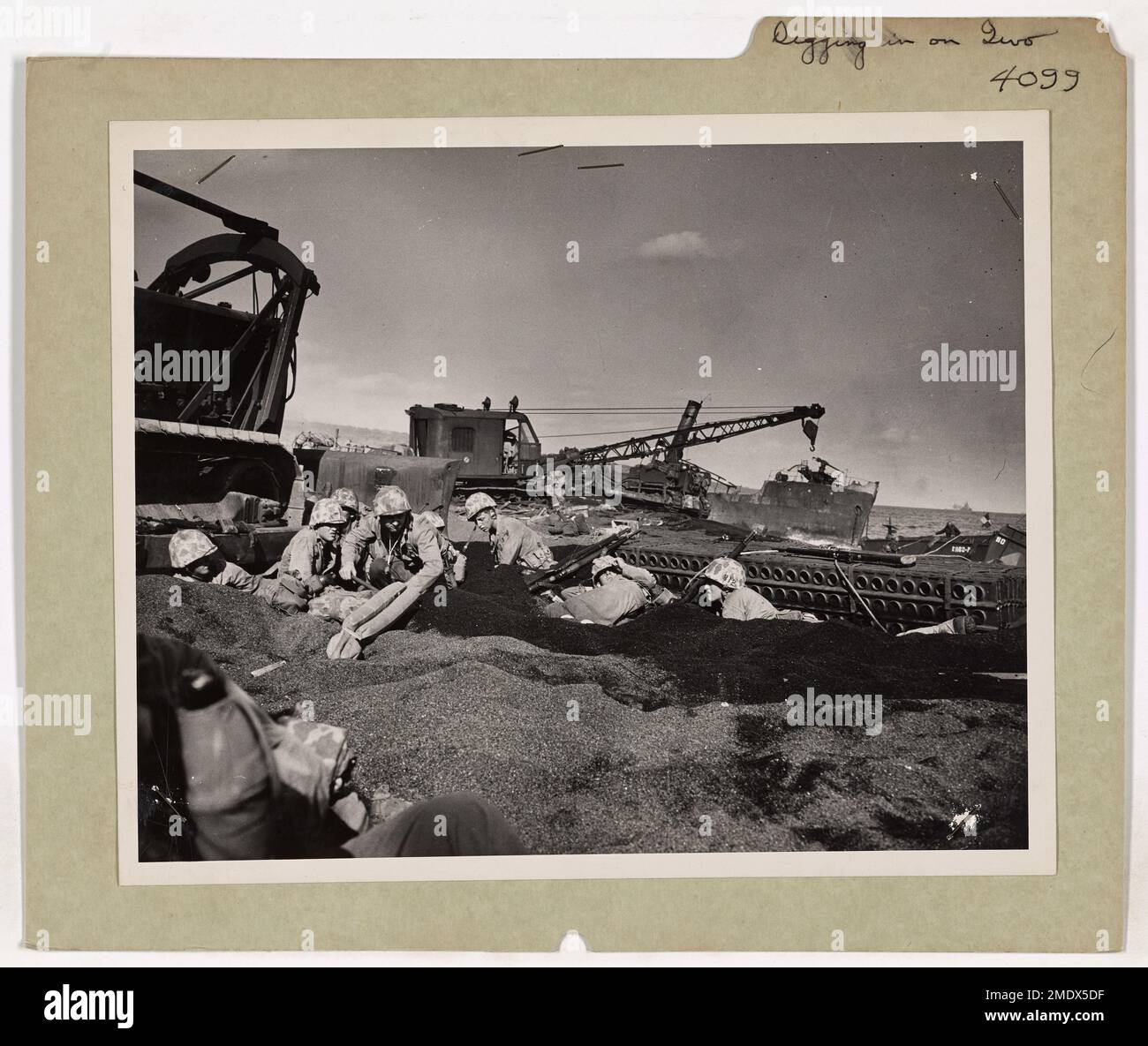 Marines in the first wave of the Iwo Jima invasion dig foxholes in the ...