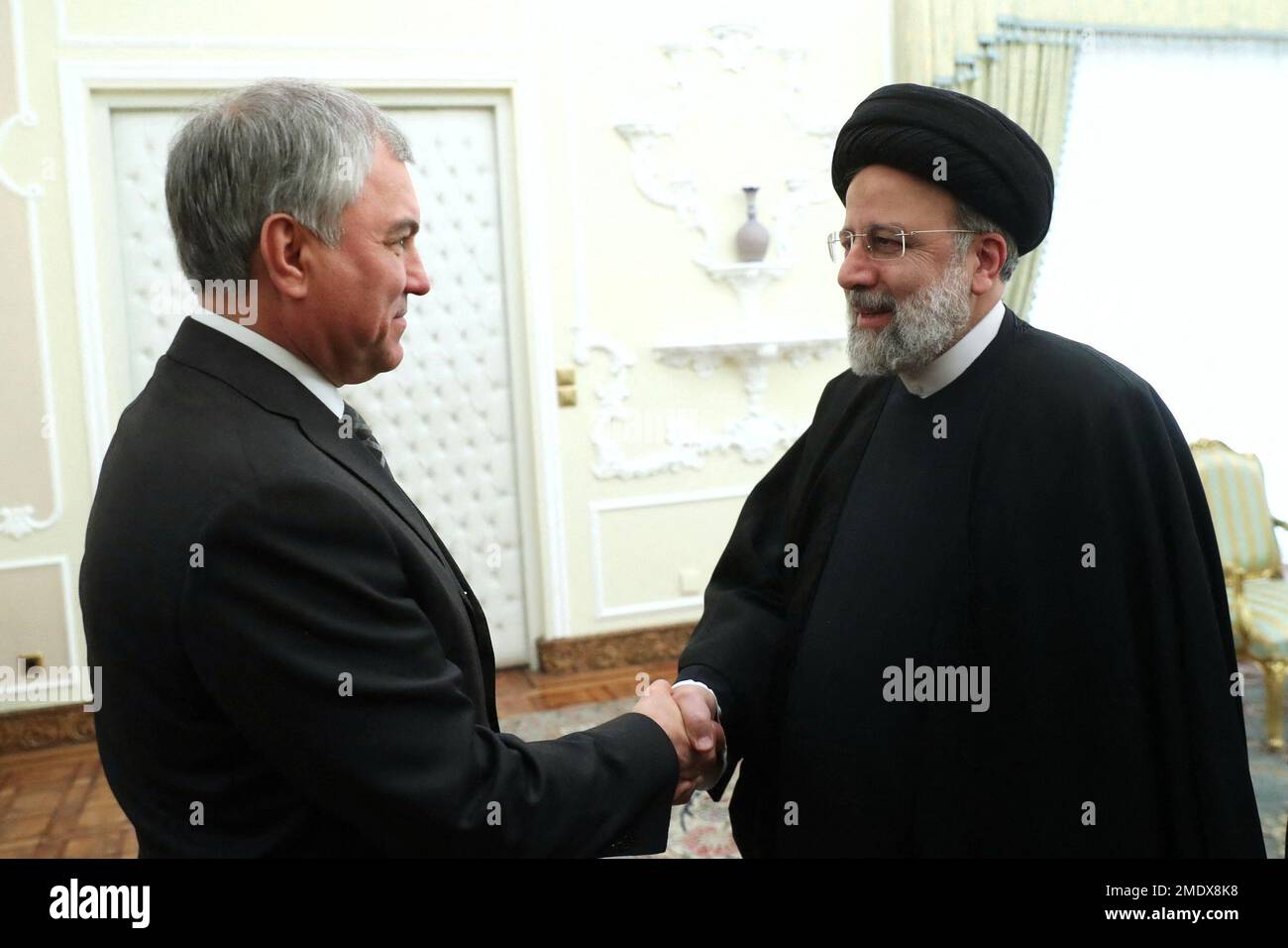 Iranian President Ebrahim Raisi (R) meets Russian State Duma ...