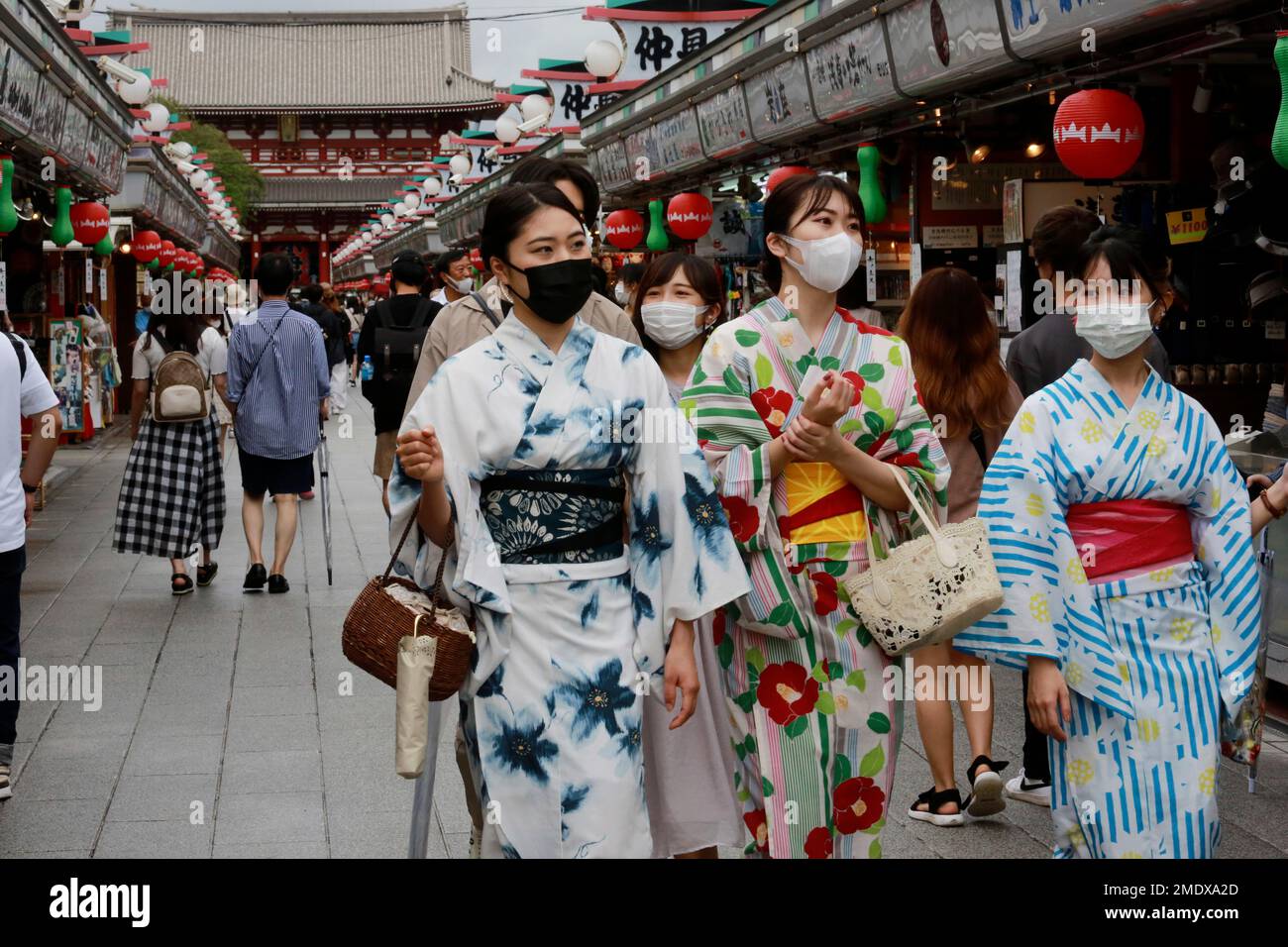 Women wearing yukata and face masks to protect against the spread of ...
