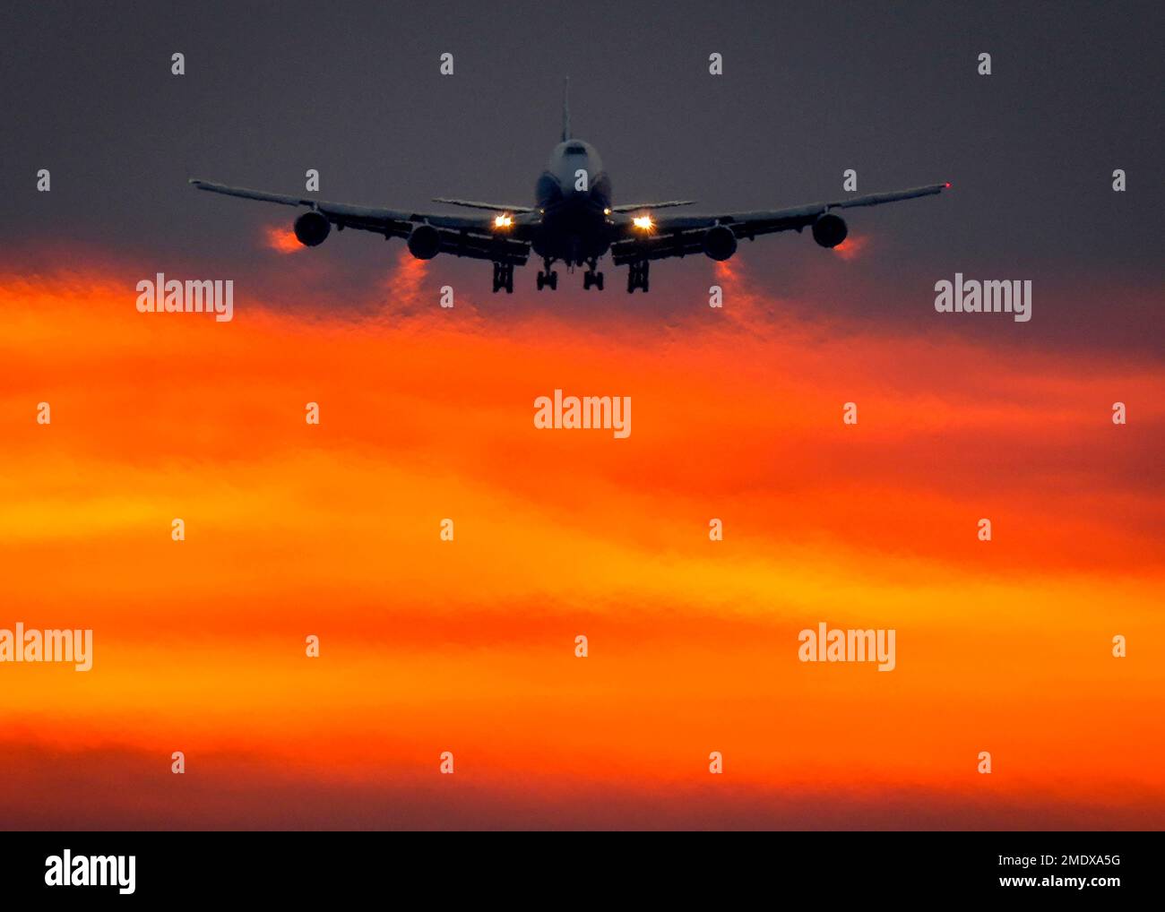 An aircraft approaches the international airport in Frankfurt, Germany ...