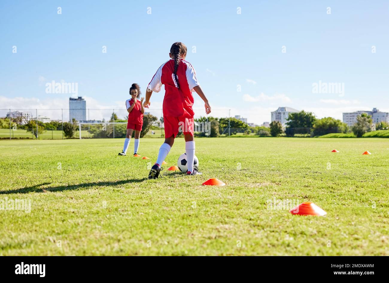 Soccer, running or sports and a girl team playing with a ball together ...